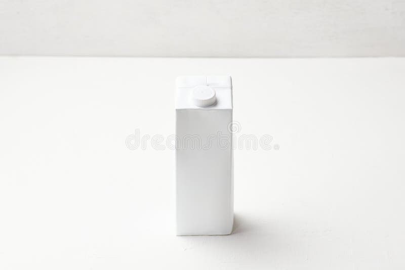 Plain White Carton Resting on a Neutral Surface in a Bright, Minimalist ...