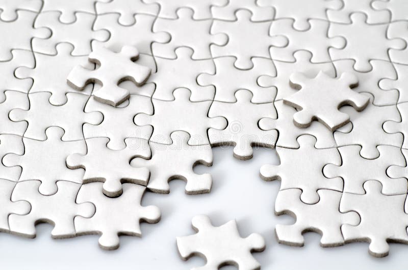 Plain white jigsaw puzzle stock photo. Image of patience - 40343096