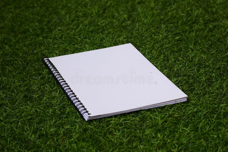 Plain White Notebook on Green Grass Stock Photo - Image of notebook ...