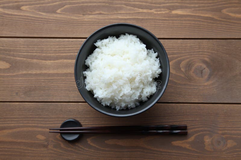 Plain White Rice in Bowl with Chopsticks Isolated on Table Stock Image ...