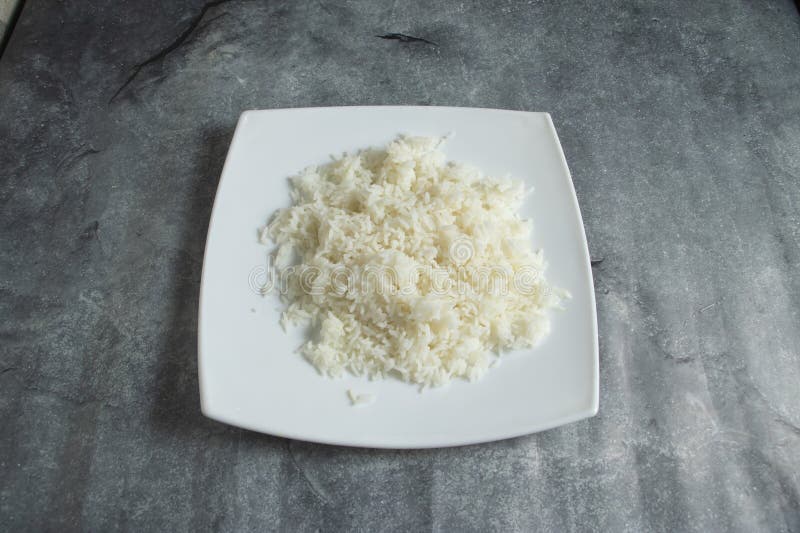 Plain White Steamed Rice Served on White Plate Over Gray Stone ...