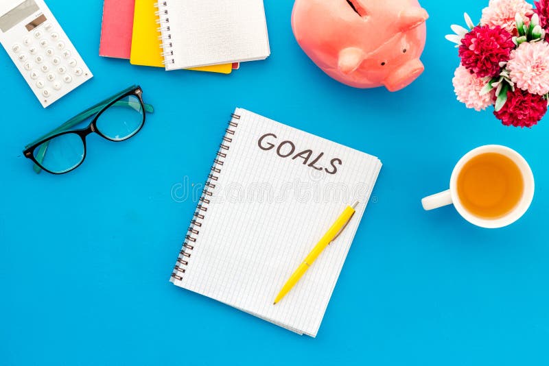 Plan Concept. Goals Text in Blank Notebook on Blue Office Desk Top-down ...