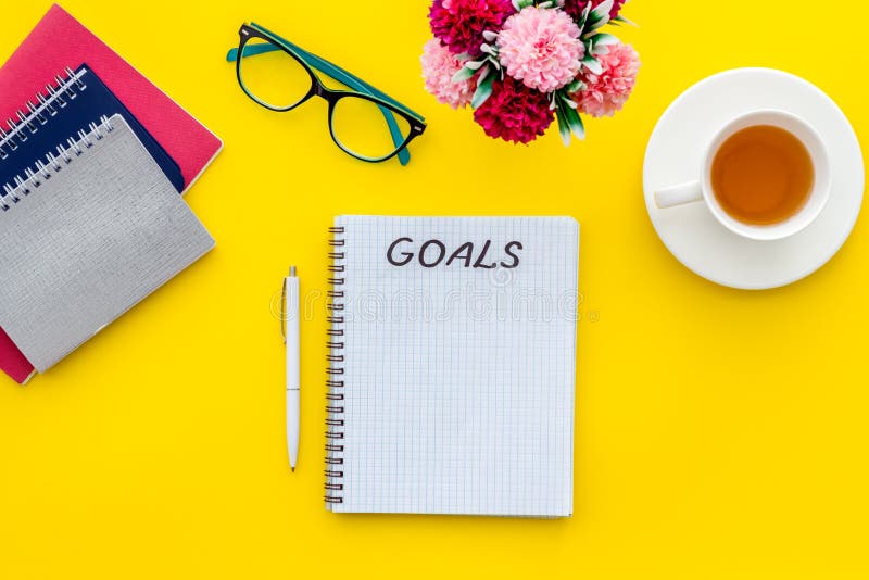 Plan Concept. Goals Text in Blank Notebook on Yellow Office Desk Top ...