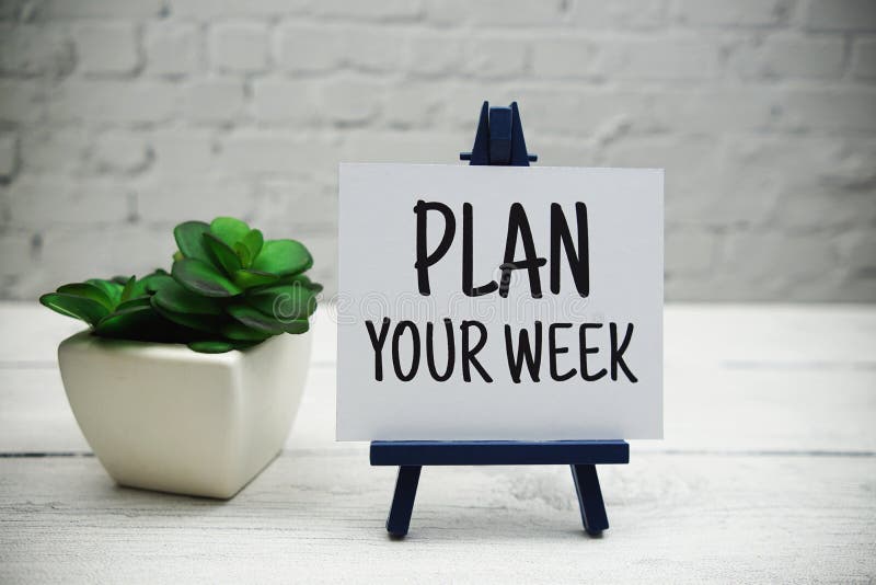 Plan Your Week Text on White Brick Wall and Wooden Background Stock ...