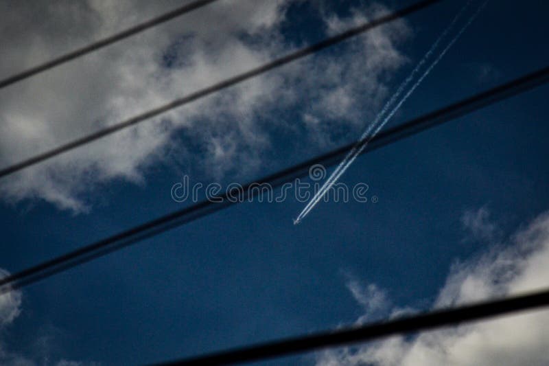 Plane above power lines stock image. Image of light - 220116807