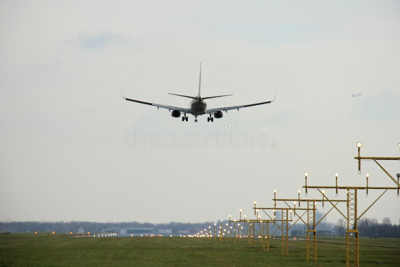 Plane approaching runway stock photo. Image of tail, angle - 71067724
