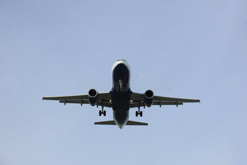 Plane approaching runway stock photo. Image of wings - 71483292