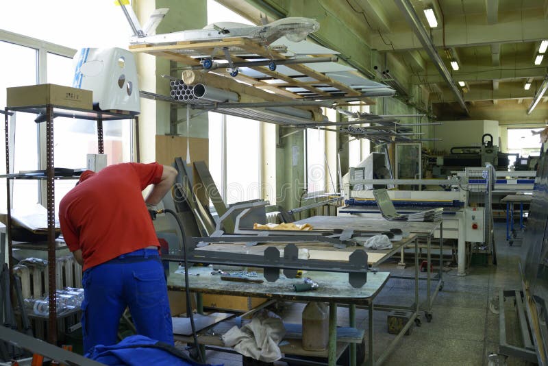 Worker Assembling Fuselage of a Light Passenger Plane at the Assembly ...