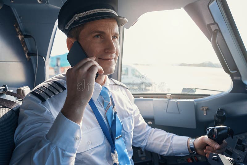 Pilot Bringing Microphone of Headset To His Mouth Stock Image - Image ...