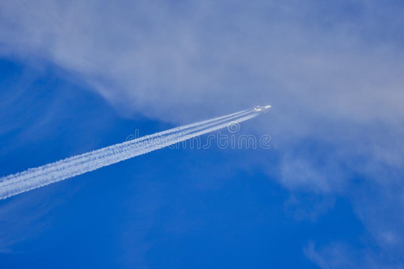 Plane Climbing with Tracks Behind it in the Blue Sky Stock Image ...