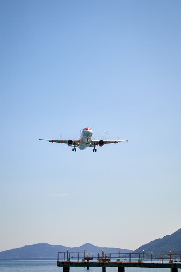 Plane Comes Close Over the Water To Land Stock Image - Image of engine ...