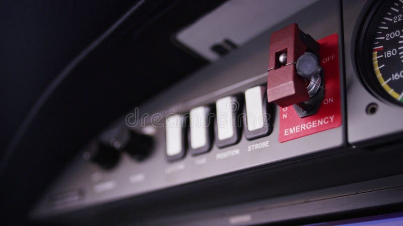 Plane Control Panel. Switches on Plane Cockpit. Red Emergency Button in ...