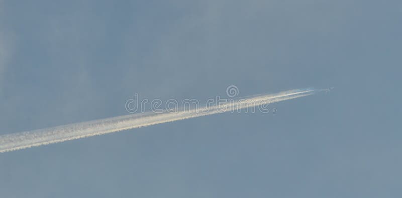 Plane at cruising altitude stock photo. Image of mountain - 94265830
