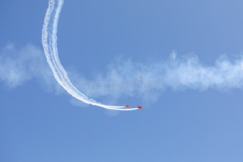 Plane Doing Acrobatic Formation in the Blue Sky. Airplanes on Airshow ... Plane Doing Acrobatic Formation in the Blue Sky. Airplanes on Airshow ...
