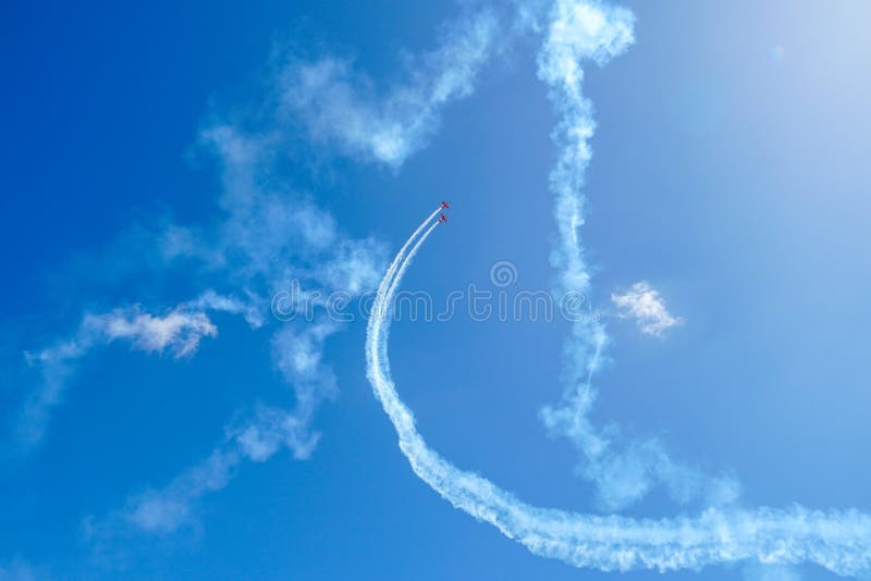 Plane Doing Acrobatic Formation in the Blue Sky. Airplanes on Airshow ... Plane Doing Acrobatic Formation in the Blue Sky. Airplanes on Airshow ...