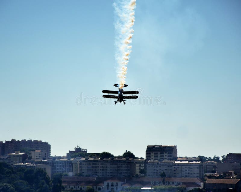 Plane Doing Stunts and Dropping Smoke Stock Photo - Image of plane ...