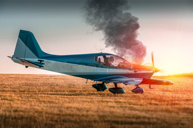 Plane Emergency Landing. Airplane with Smoke from the Engine. Fire in ...