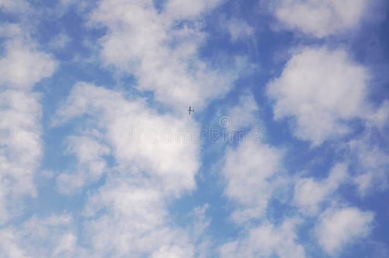 A Plane of the Far Background of the Blue Sky. Stock Photo - Image of ...