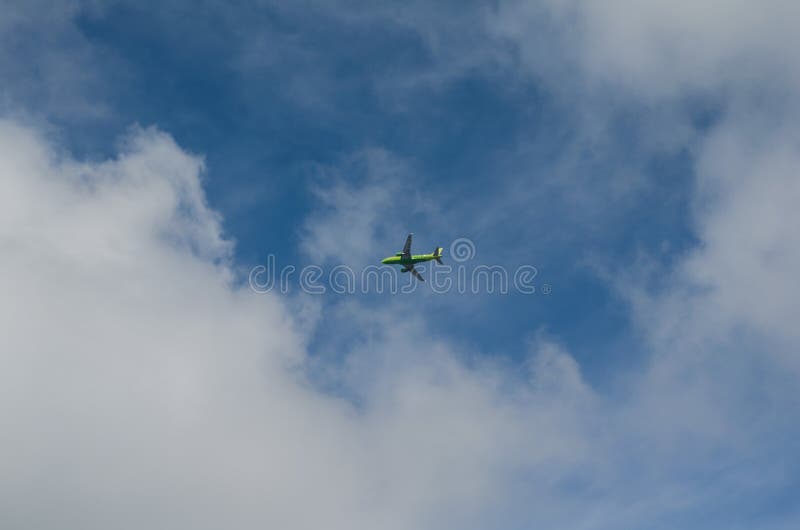 Plane Flies in a Cloudy Blue Sky Stock Image - Image of wings, airport ...