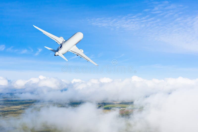 The Plane Flies into the Distance Above the Clouds, Gaining Altitude ...