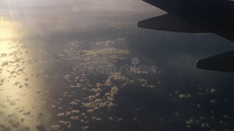 Plane Flies Over the Atlantic Ocean during Sunrise - the View from the ...