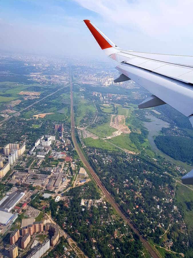 The Plane Flies Over the City Stock Photo - Image of town, airplane ...