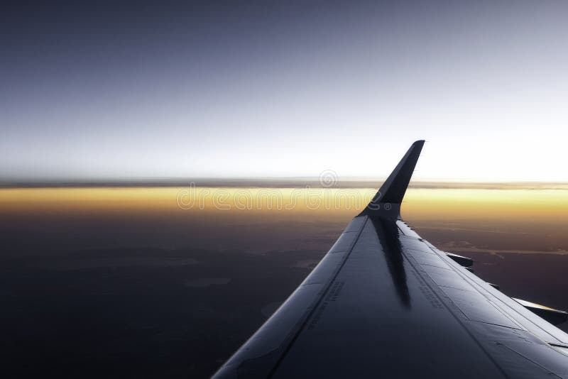 Plane flight at sunset stock photo. Image of transportation - 93236986
