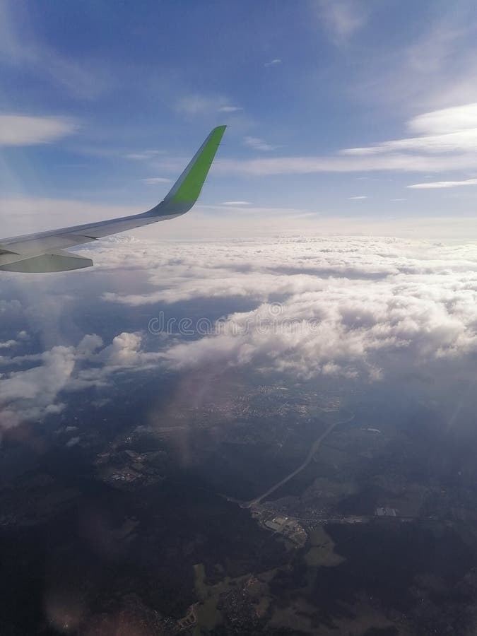 The Plane is Flying Above the Clouds Stock Image - Image of clouds ...