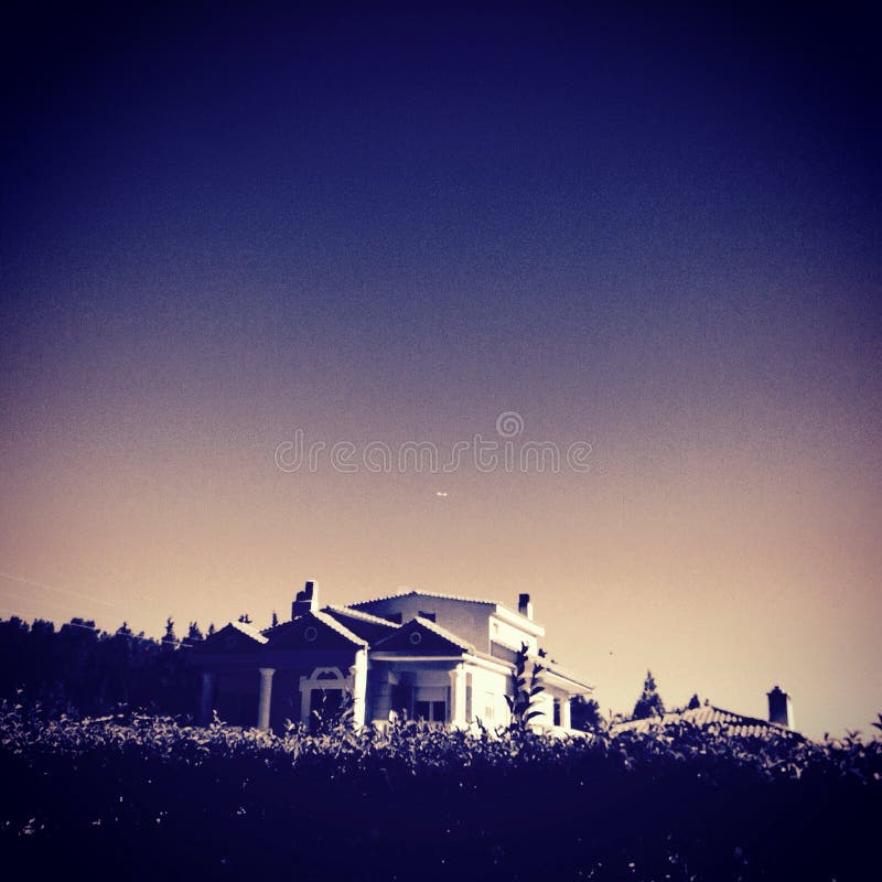 Plane flying above a house stock photo. Image of plane - 49953160