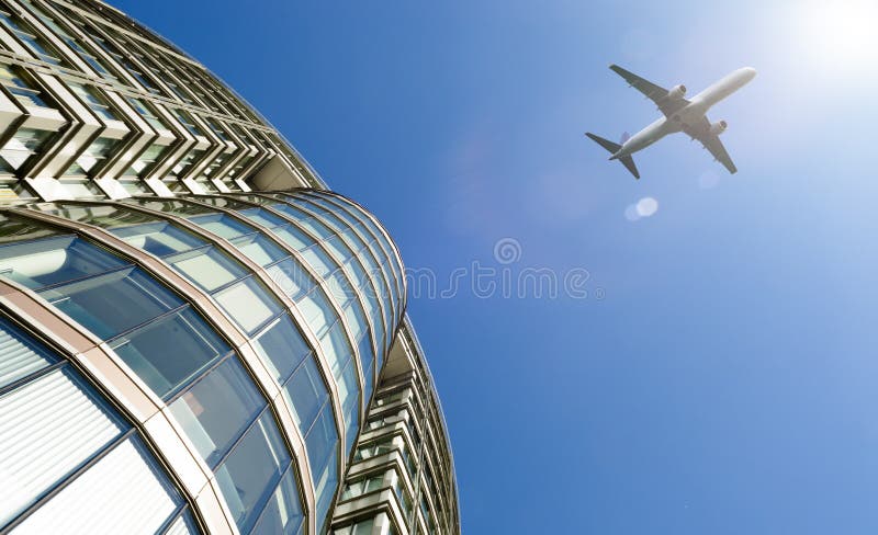 Plane Flying Above Modern Office Building. Stock Image - Image of plane ...