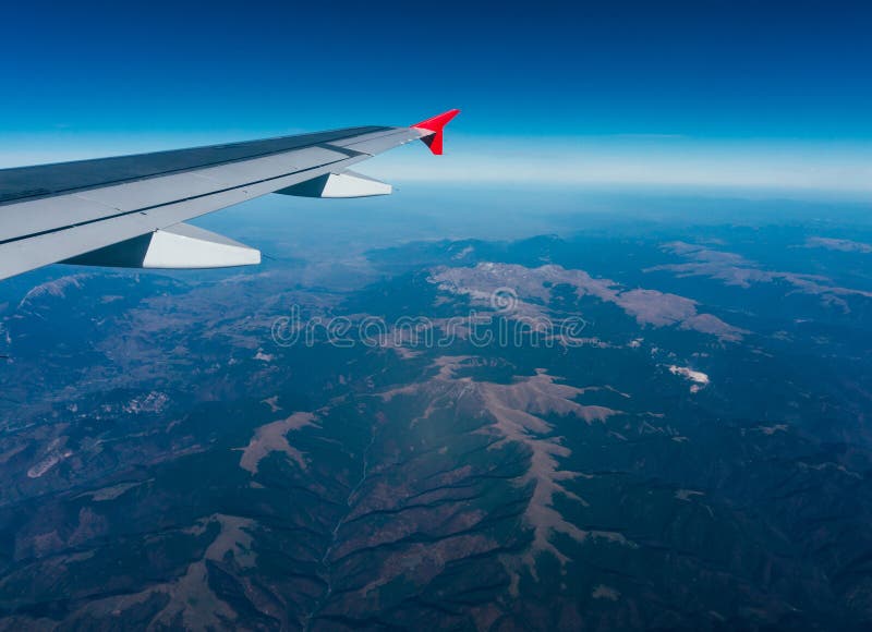 Plane Flying Above Mountains Stock Image - Image of land, scene: 204428855