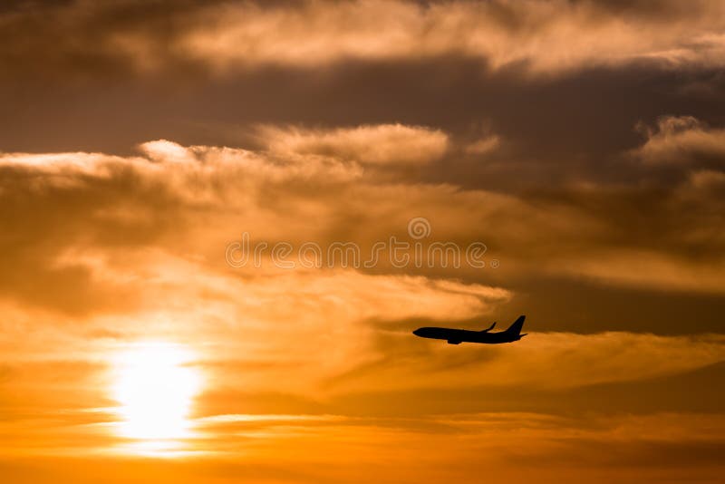 A Plane Flying at Beautiful Sunset Stock Photo - Image of dawn ...