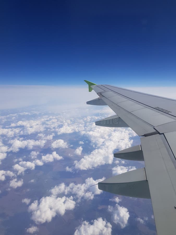 The Plane Flies in the Blue Sky Stock Photo - Image of plane, cloud ...