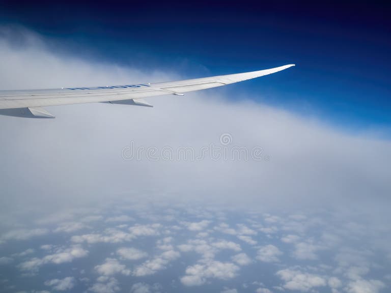 Plane Flying between Cloud Layers Viewed from Passenger Cabin Window ...