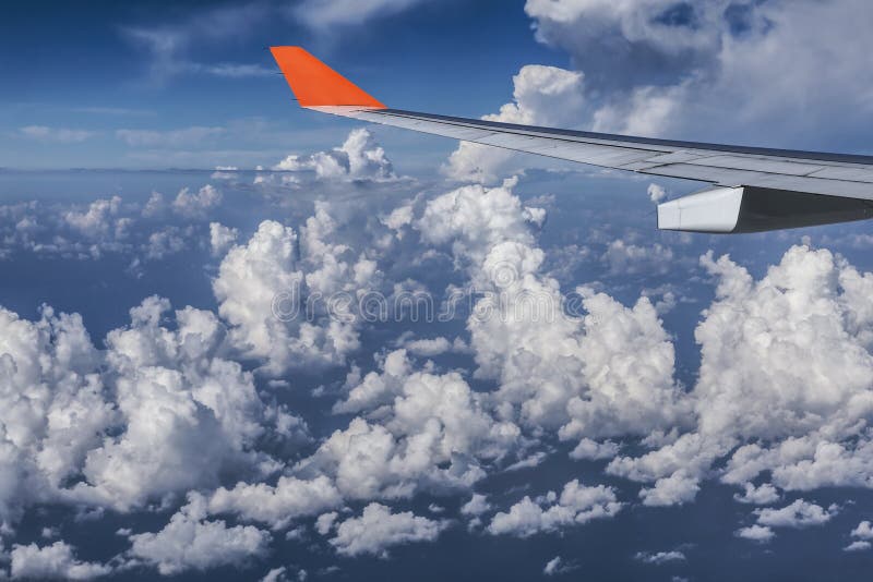 Plane Flying High Above the Clouds Stock Image - Image of plane ...