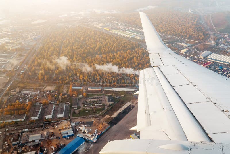Plane flying over big city stock photo. Image of nature - 172664106