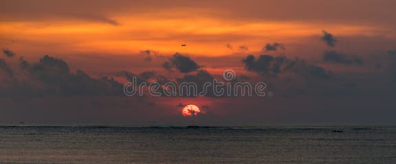 Plane Flying Over the Sun in a Bali Sunset Stock Photo - Image of ...