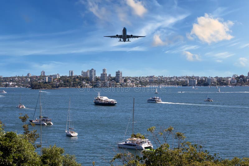 Plane Flying Over Sydney Harbour Sydney NSW Australia. Stock Photo ...