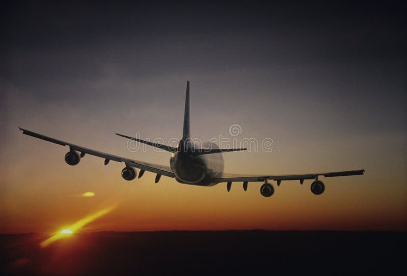 Plane Flying Sun Setting on Horizon Back View Stock Image - Image of ...