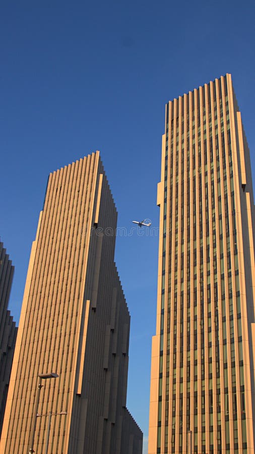 Plane Flying between Two Modern Buildings Stock Image - Image of living ...