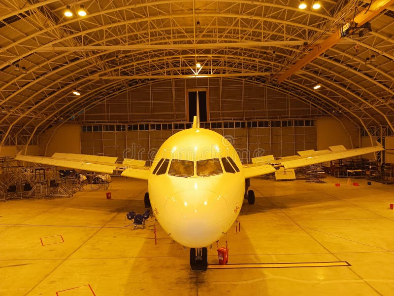 The Plane in the Hangar is Under Repair and Maintenance Stock Image ...