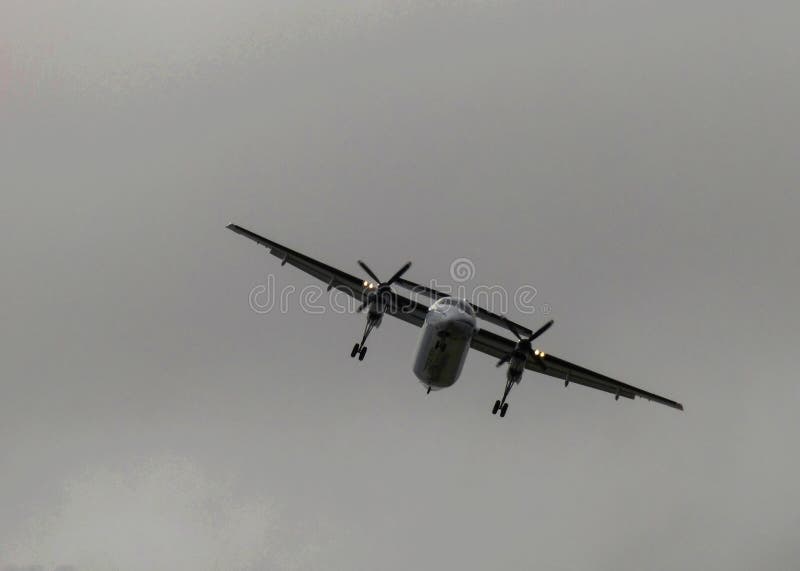 Airplane in the grey sky stock image. Image of plane - 263694683