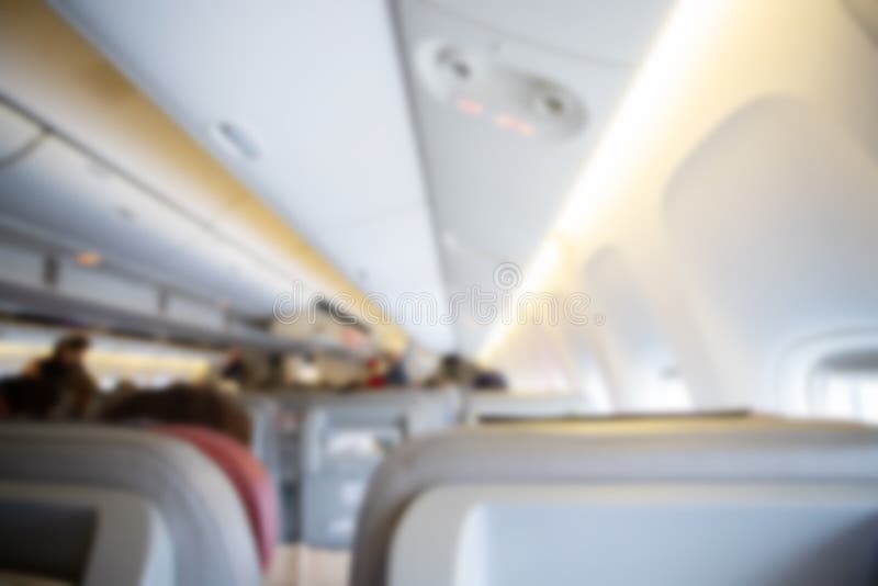 Plane Inside, Cabin of Airplane, Passenger Seats Blurred Background ...