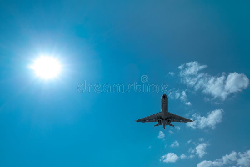 Plane Landing Against the Backdrop of the Sun Stock Photo - Image of ...