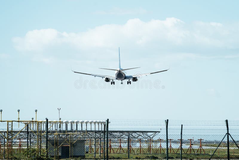 Plane Landing at the Airstrip Header Stock Photo - Image of arriving ...