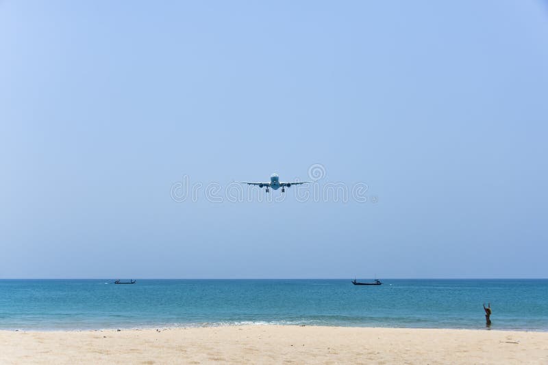 Plane is Landing Over the Beach Stock Photo - Image of ocean, tourism ...