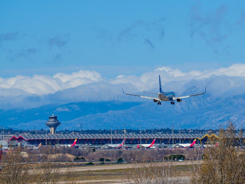 Plane Landing on the Runway of Madrid Airport, Stock Image - Image of ...
