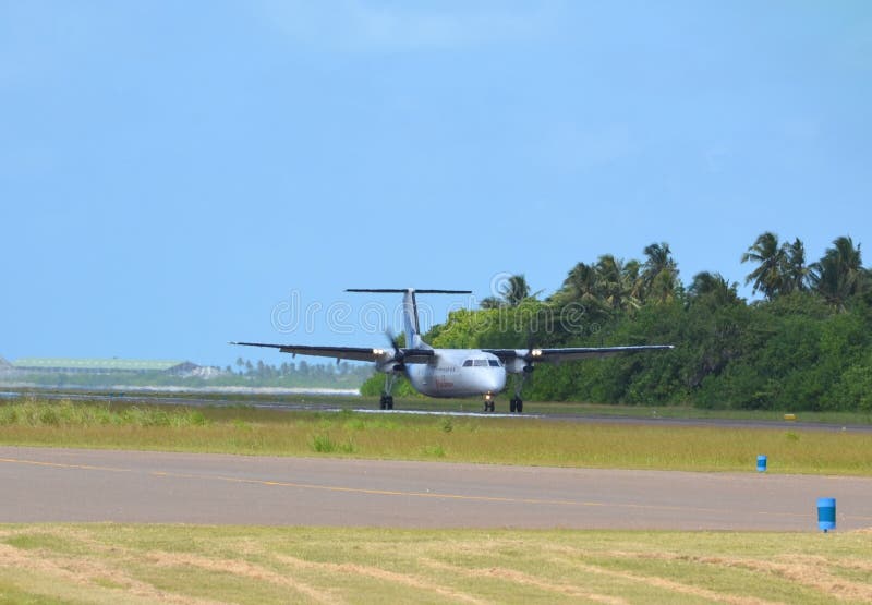 Plane landing editorial stock image. Image of commuter - 77079264
