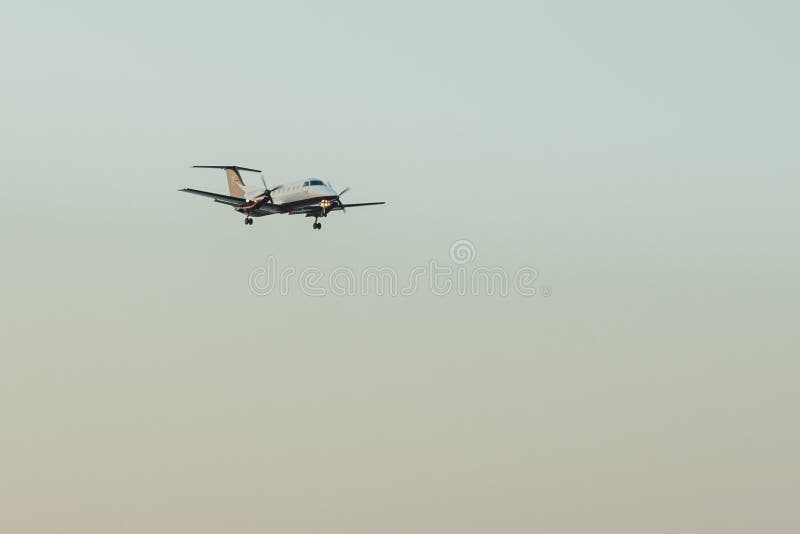 Small Propeller Plane Flying in the Sky. Plane is Landing Stock Photo ...