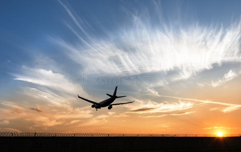 Plane is Landing at the Sunset Stock Photo - Image of wing, flying ...